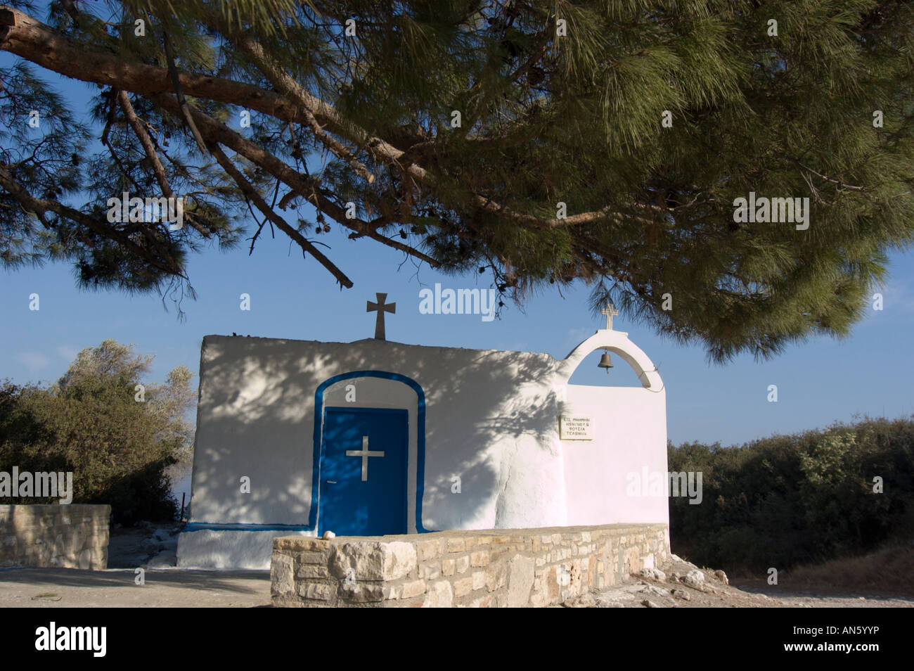 Greek orthodox chapel under a pine tree Stock Photo - Alamy