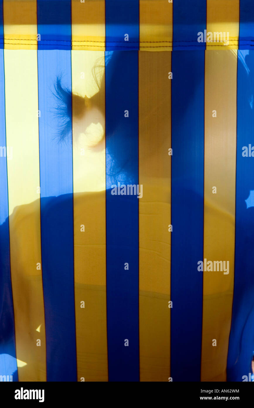 Shadow of someone relaxing in the sun in a deckchair Stock Photo - Alamy