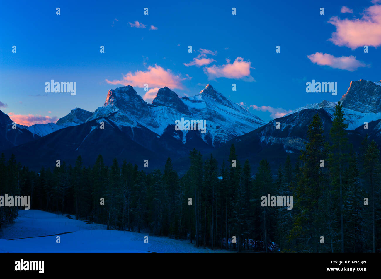 Three Sisters Mountain Range at sunrise, Canmore, Alberta, Canada Stock ...