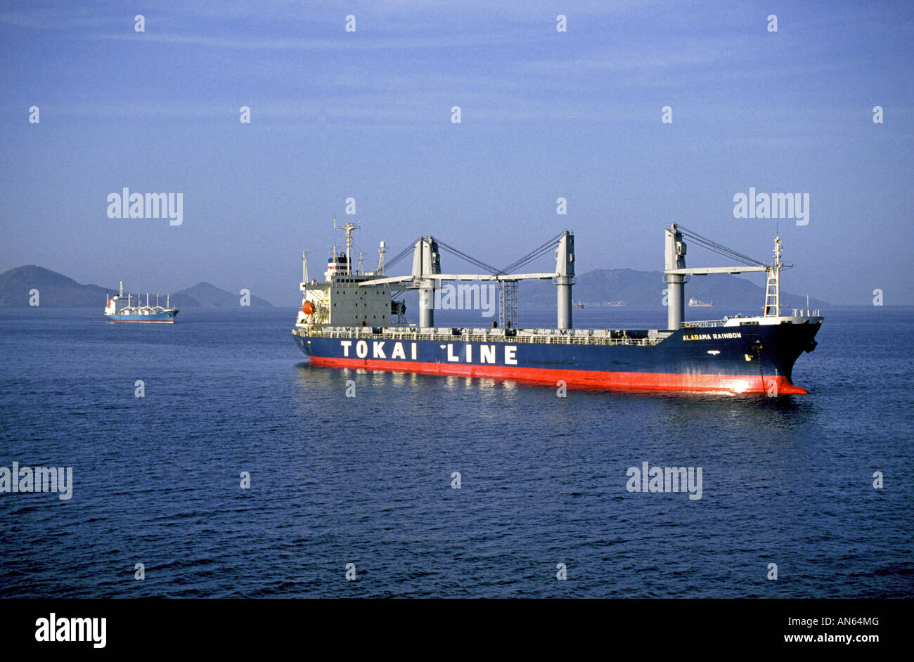 A large cargo ship prepares to make a daylight passage through the ...