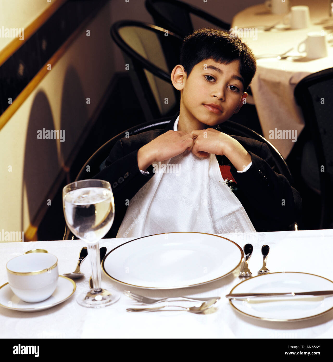 A boy ready to eat a formal dinner Stock Photo - Alamy