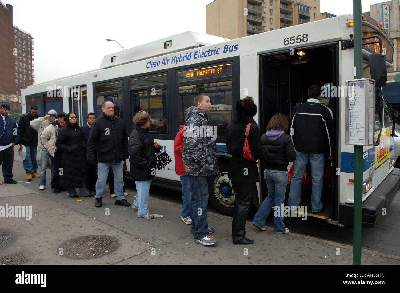 Commuters board the B58 bus in Elmhurst Queens in NYC Stock Photo - Alamy