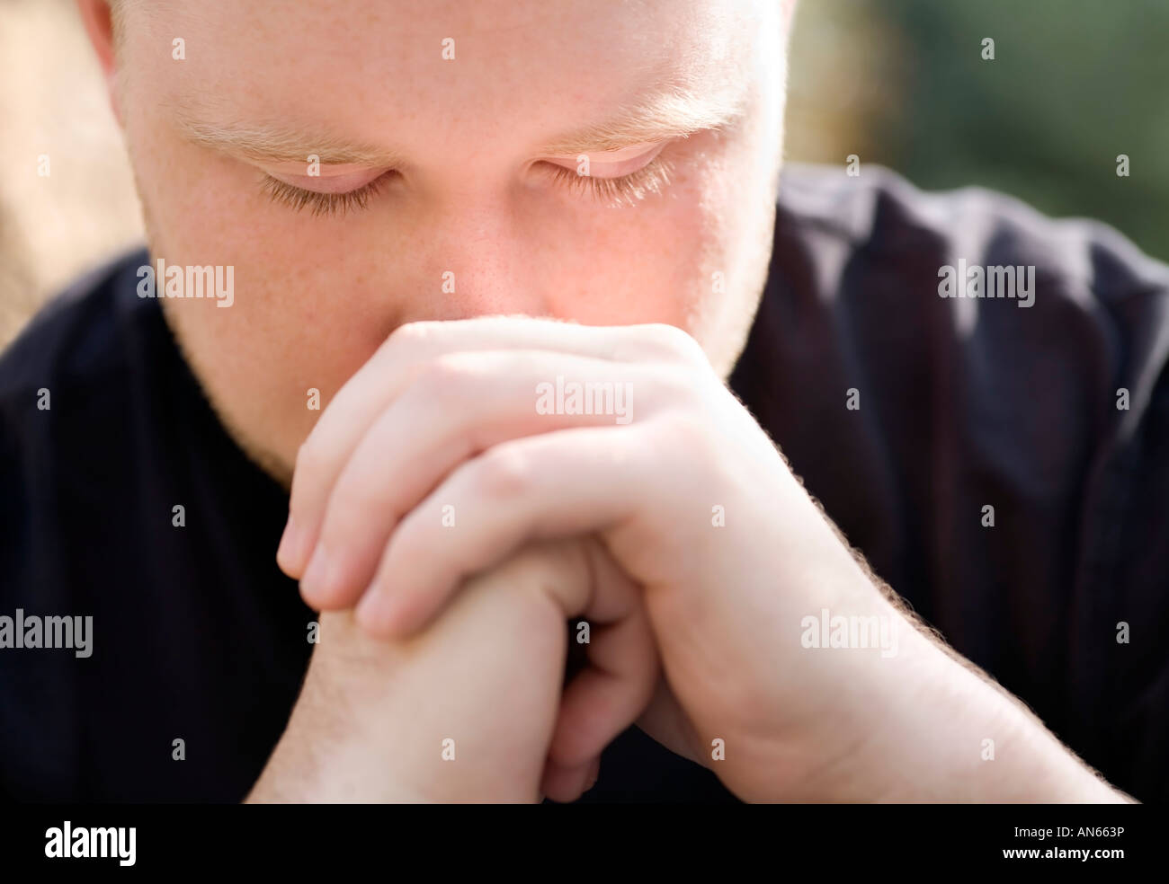 A man praying Stock Photo - Alamy