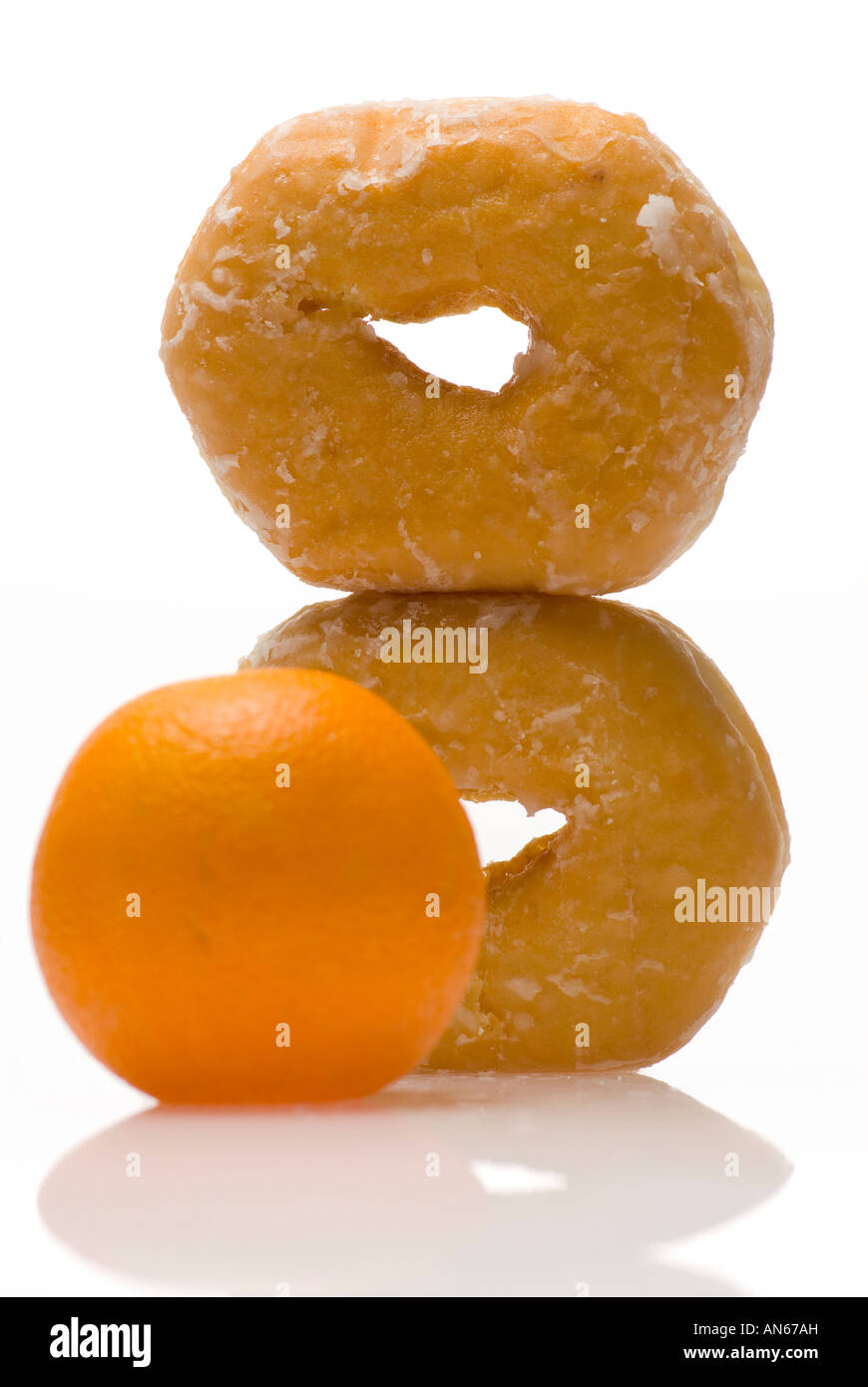 two glazed donuts with fruit showing food choices Stock Photo - Alamy