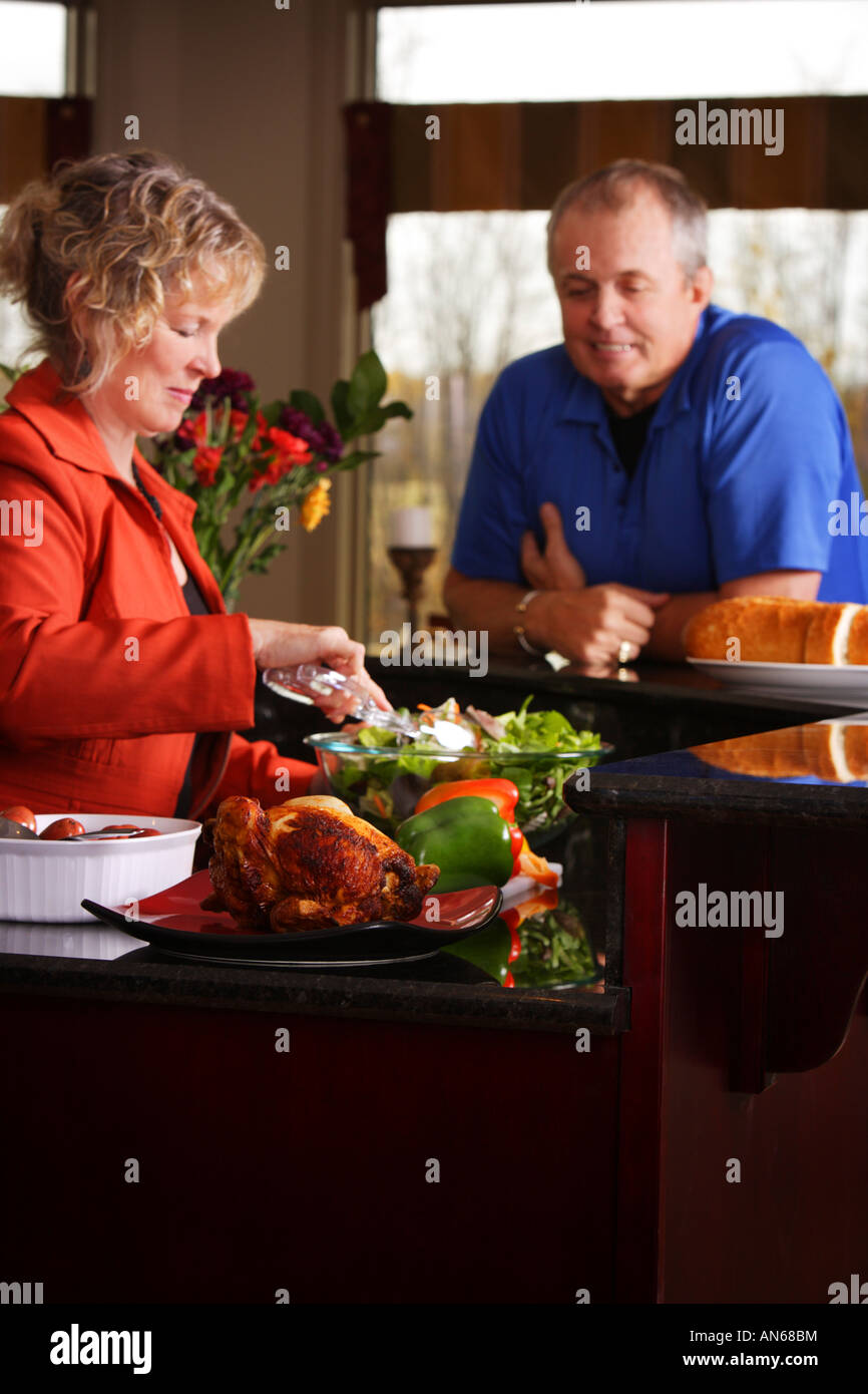 Couple making dinner Stock Photo - Alamy