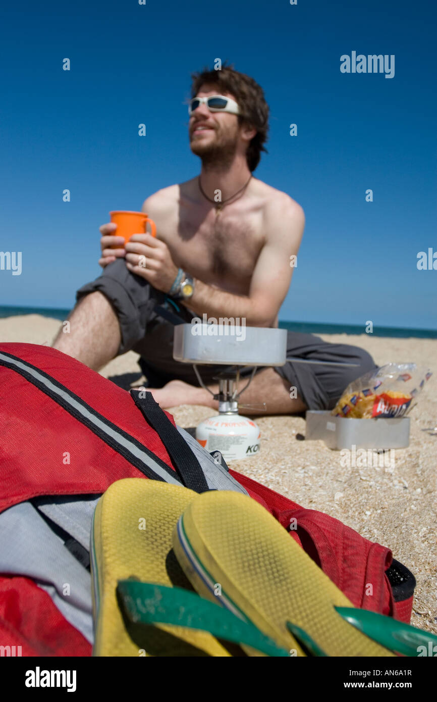 Man on Beach with Gas Stove Stock Photo - Alamy