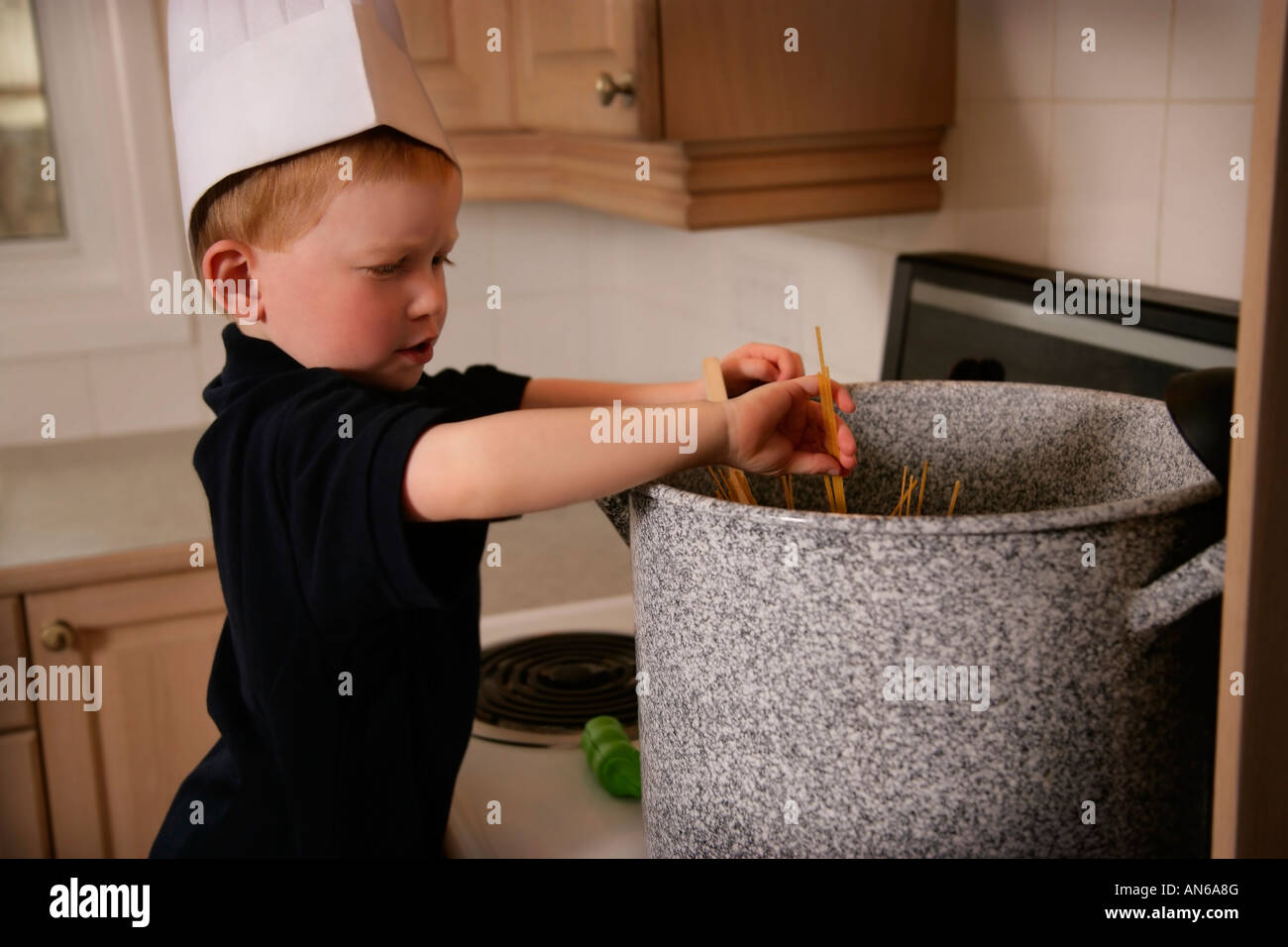 Little chef cooking Stock Photo - Alamy