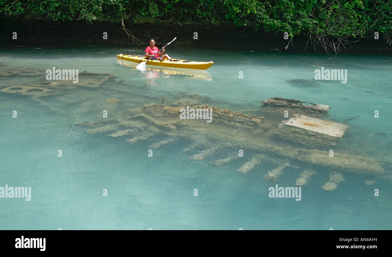 Kayker inspects sunken Japanese patrol boat in Shipwreck Bay Stock ...