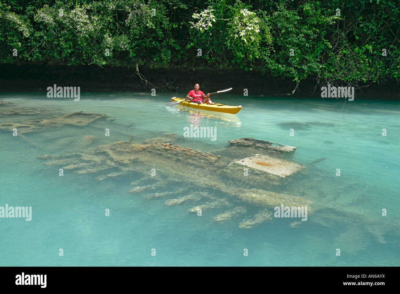 Kayker inspects sunken Japanese patrol boat in Shipwreck Bay Stock ...
