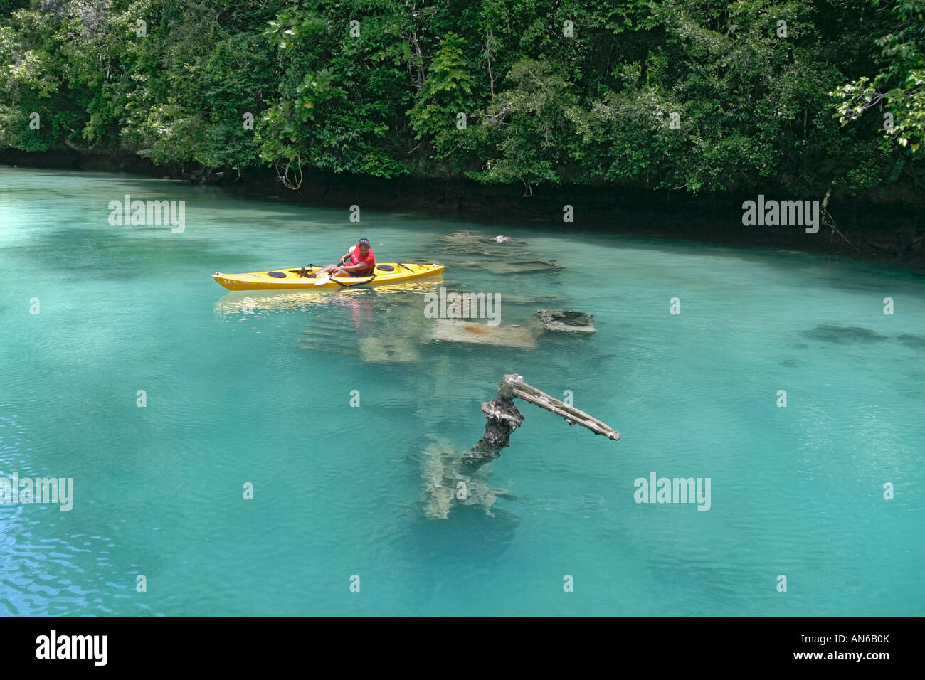 Kayker inspects sunken Japanese patrol boat in Shipwreck Bay Stock ...