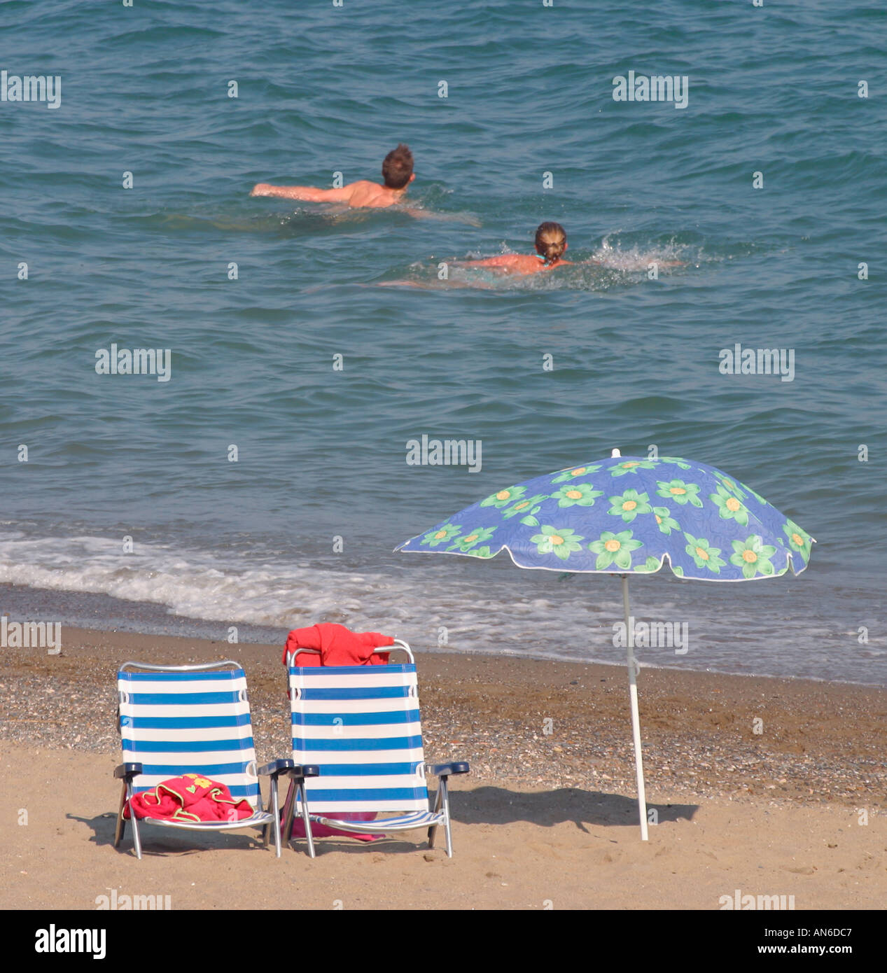 Costa del Sol Spain beach scene Couple in sea Stock Photo - Alamy