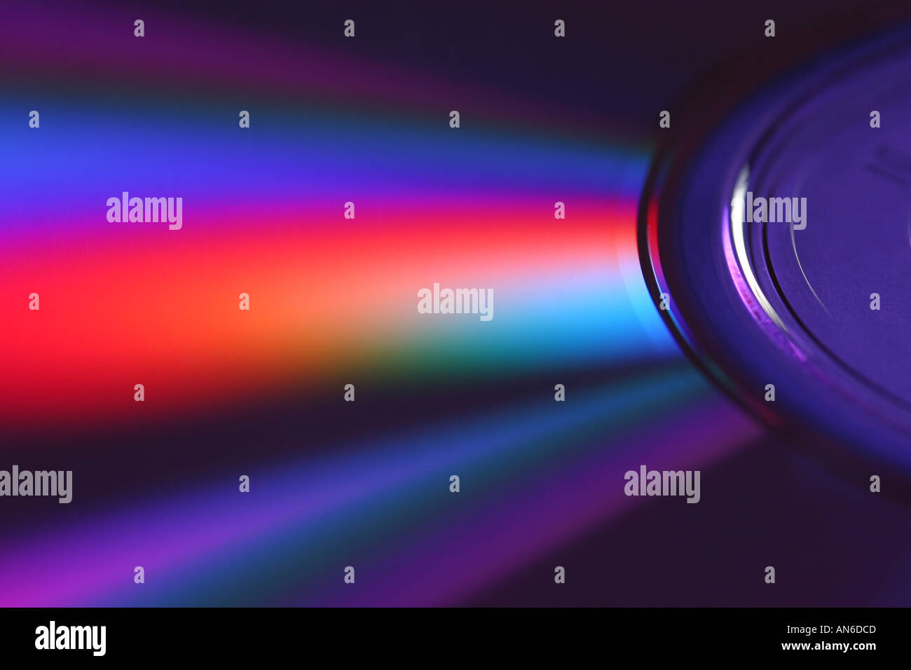 Blue CD R reflecting blue and purple light Stock Photo - Alamy