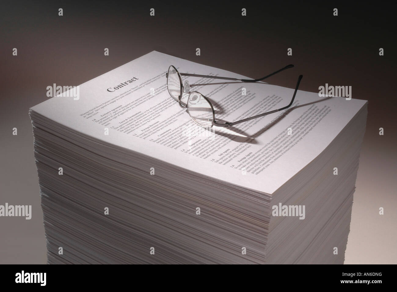 A pile of papers representing a multi page legal contract Stock Photo ...