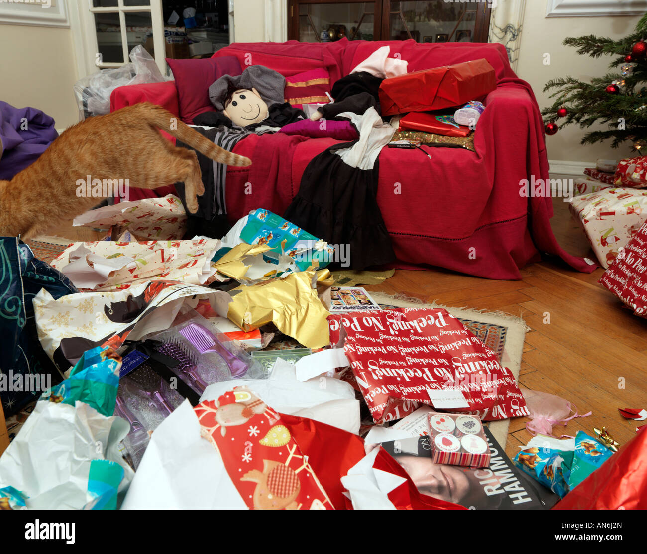 Mess christmas presents wrapping paper hi-res stock photography and ...