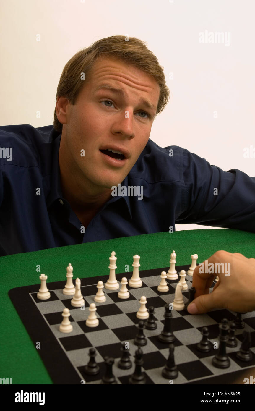 Portrait of a man loosing a game of chess Stock Photo - Alamy