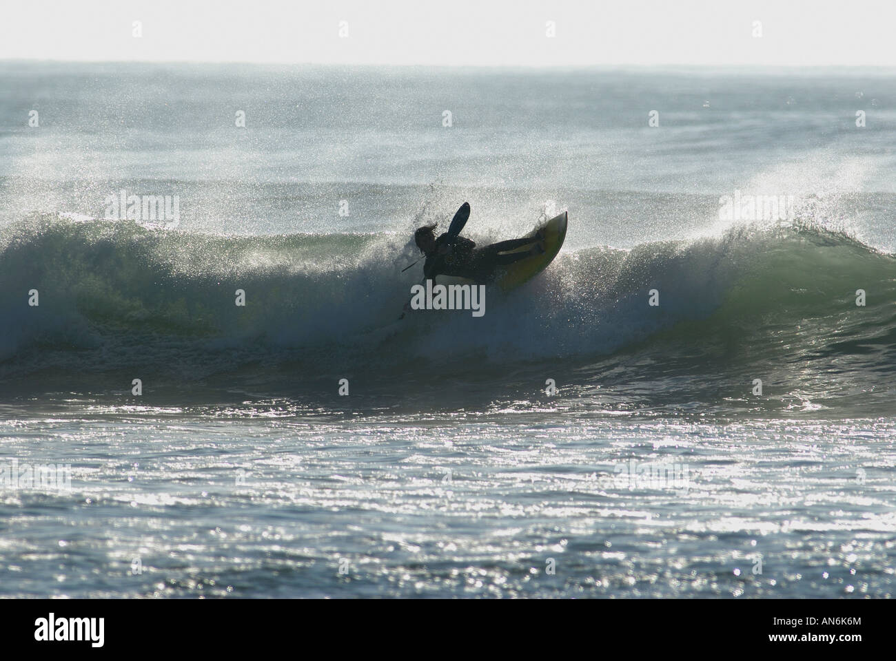 Surf Kayak in action on small wave at beach break Stock Photo - Alamy