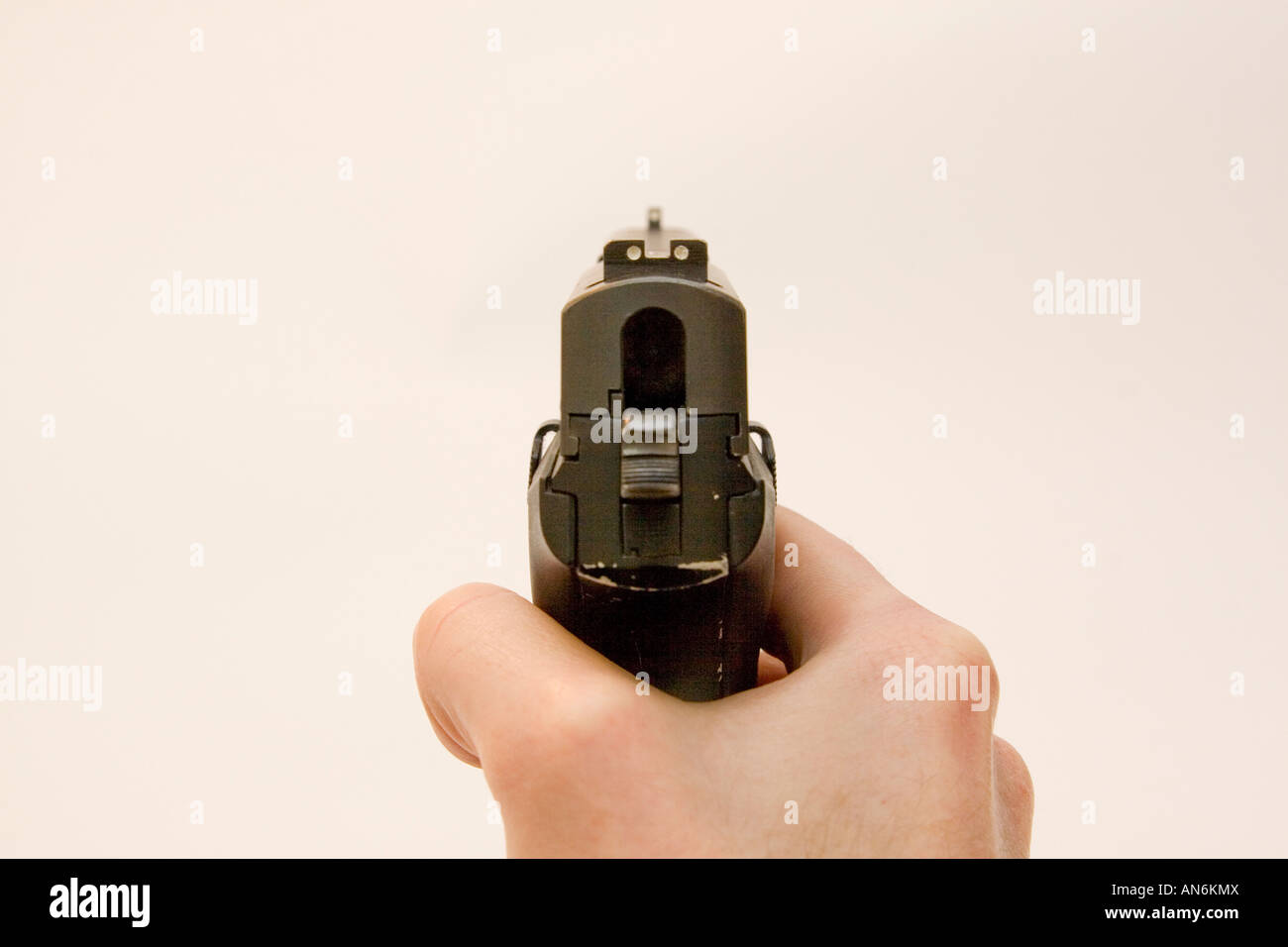 back view of a male hand holding a Czech CZ 99 9mm parabelum semi ...