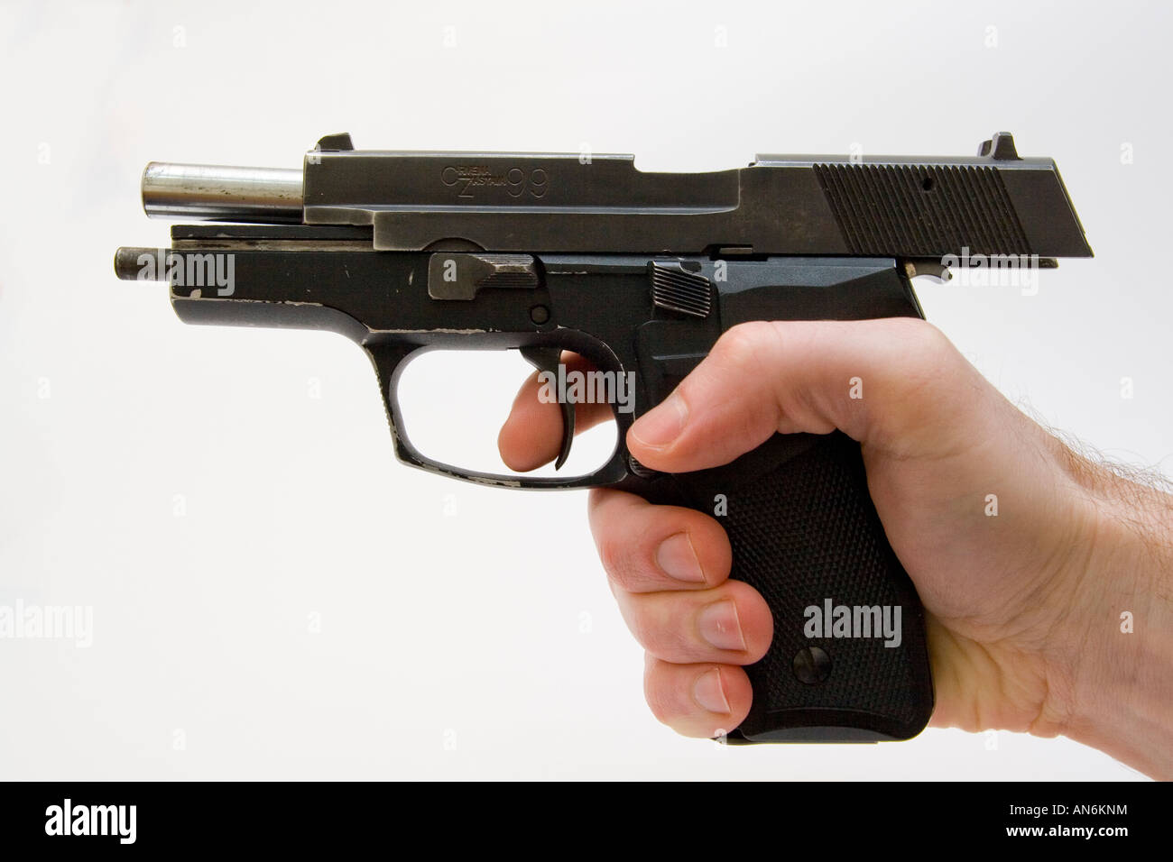 A side view of a male hand holding a Czech CZ 99 9mm parabelum semi ...