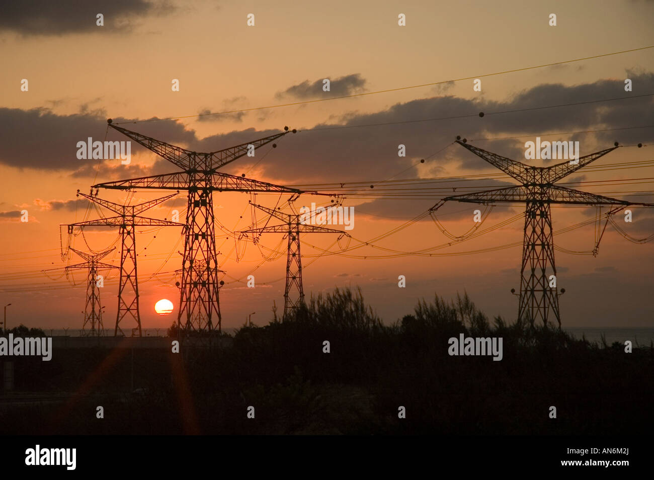 Israel Hadera Silhouette of high voltage power lines at sunset Stock ...