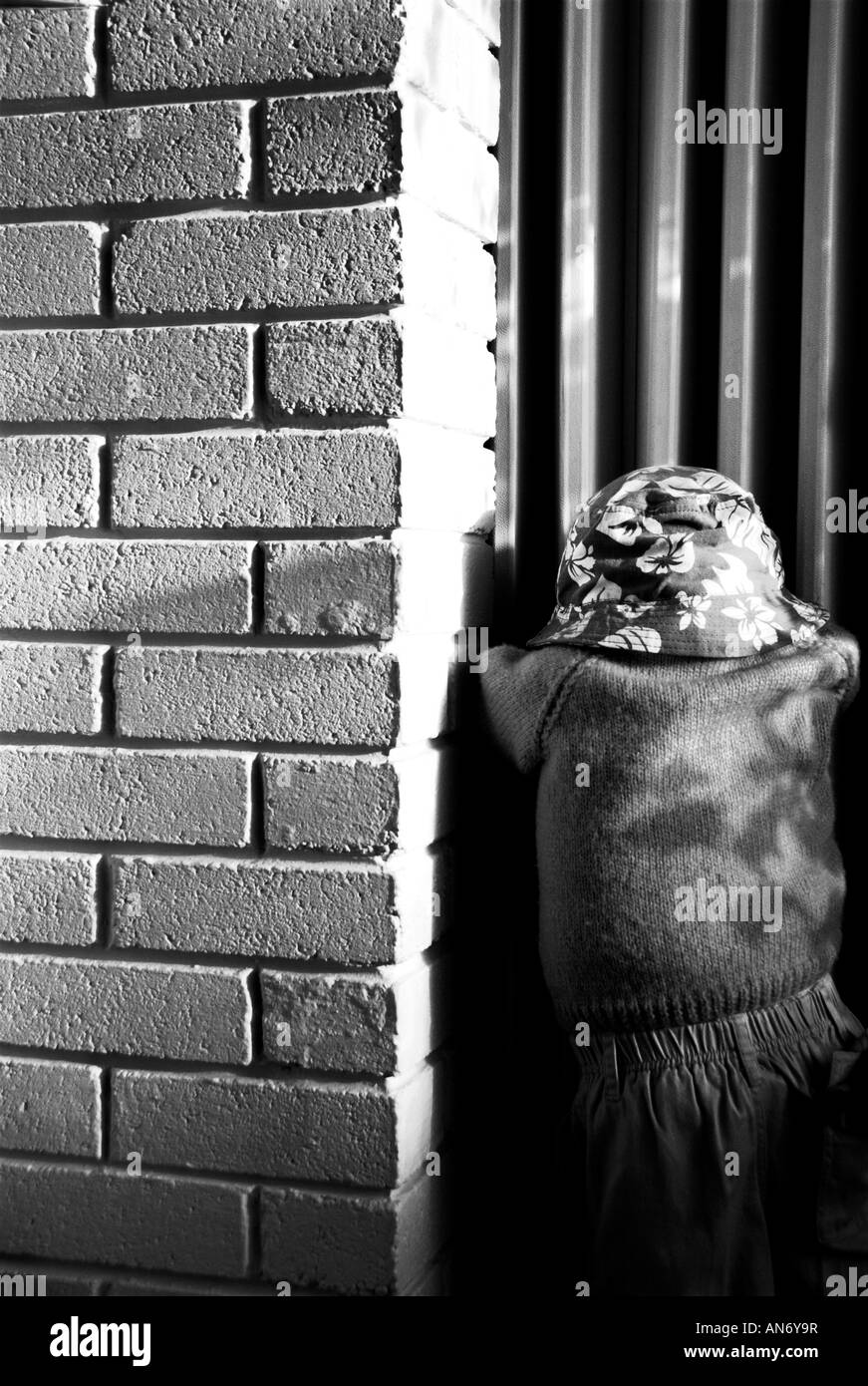 Boy facing wall Black and White Stock Photos & Images - Alamy