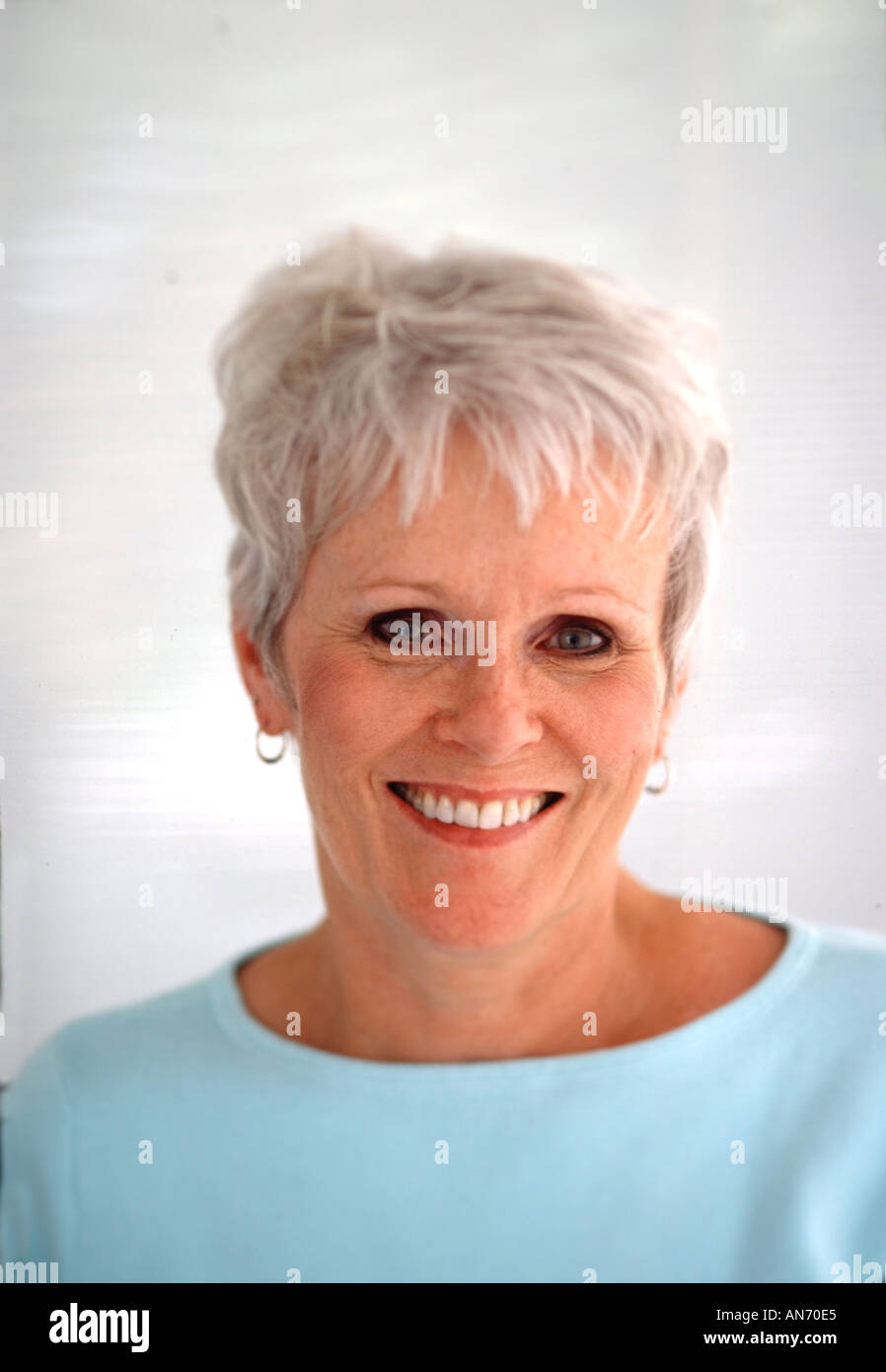 Woman s face smiling nice and pleasant Stock Photo - Alamy