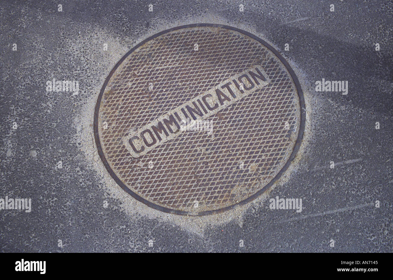 A Manhole cover with the word Communication on it Stock Photo - Alamy