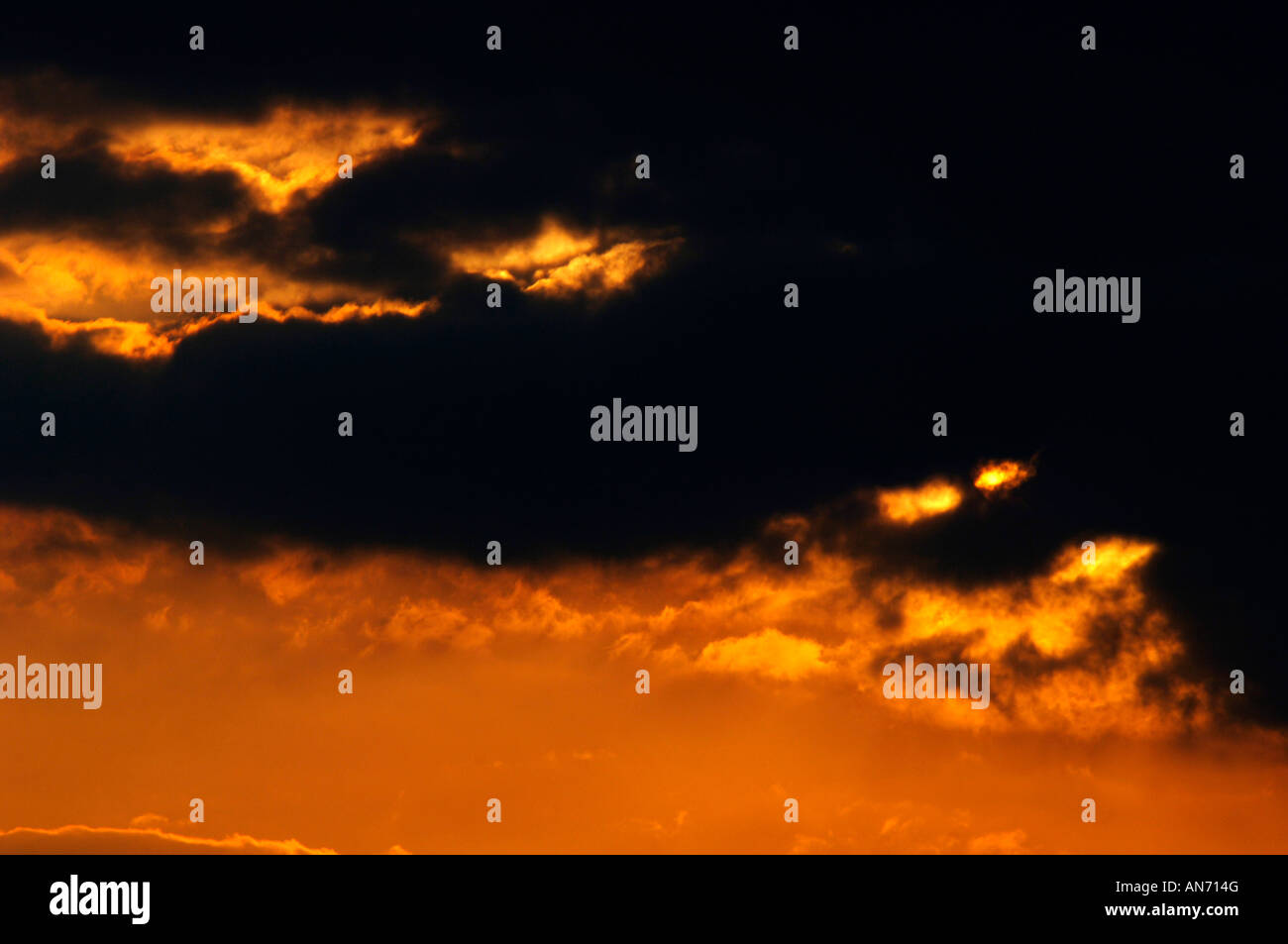 A Red Sky At Night,As The Sun Sets Behind Clouds,Producing The Warm ...