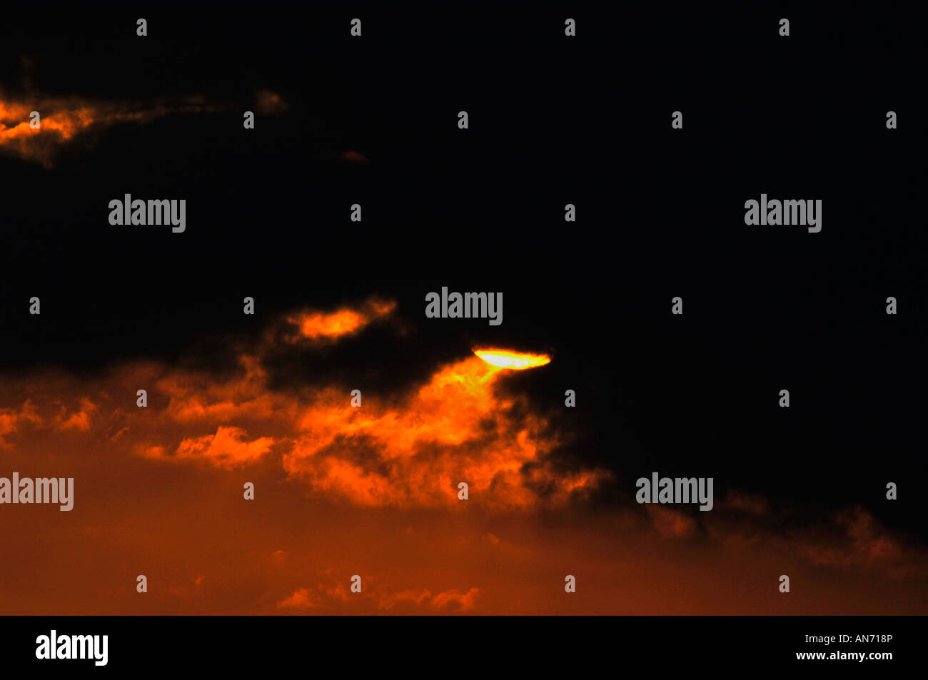 A Red Sky At Night,As The Sun Sets Behind Clouds,Producing The Warm ...