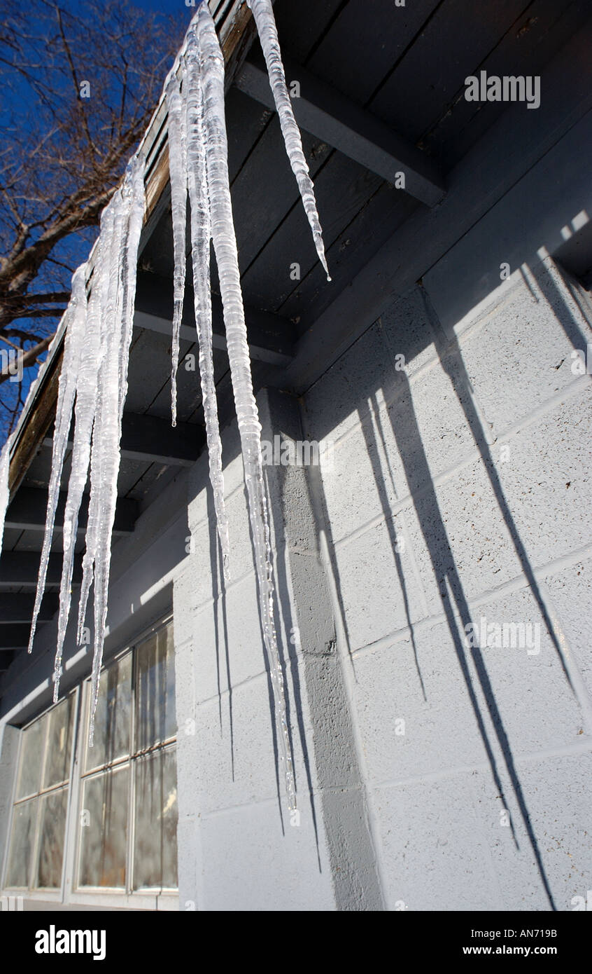Ice hanging from a roof Stock Photo - Alamy