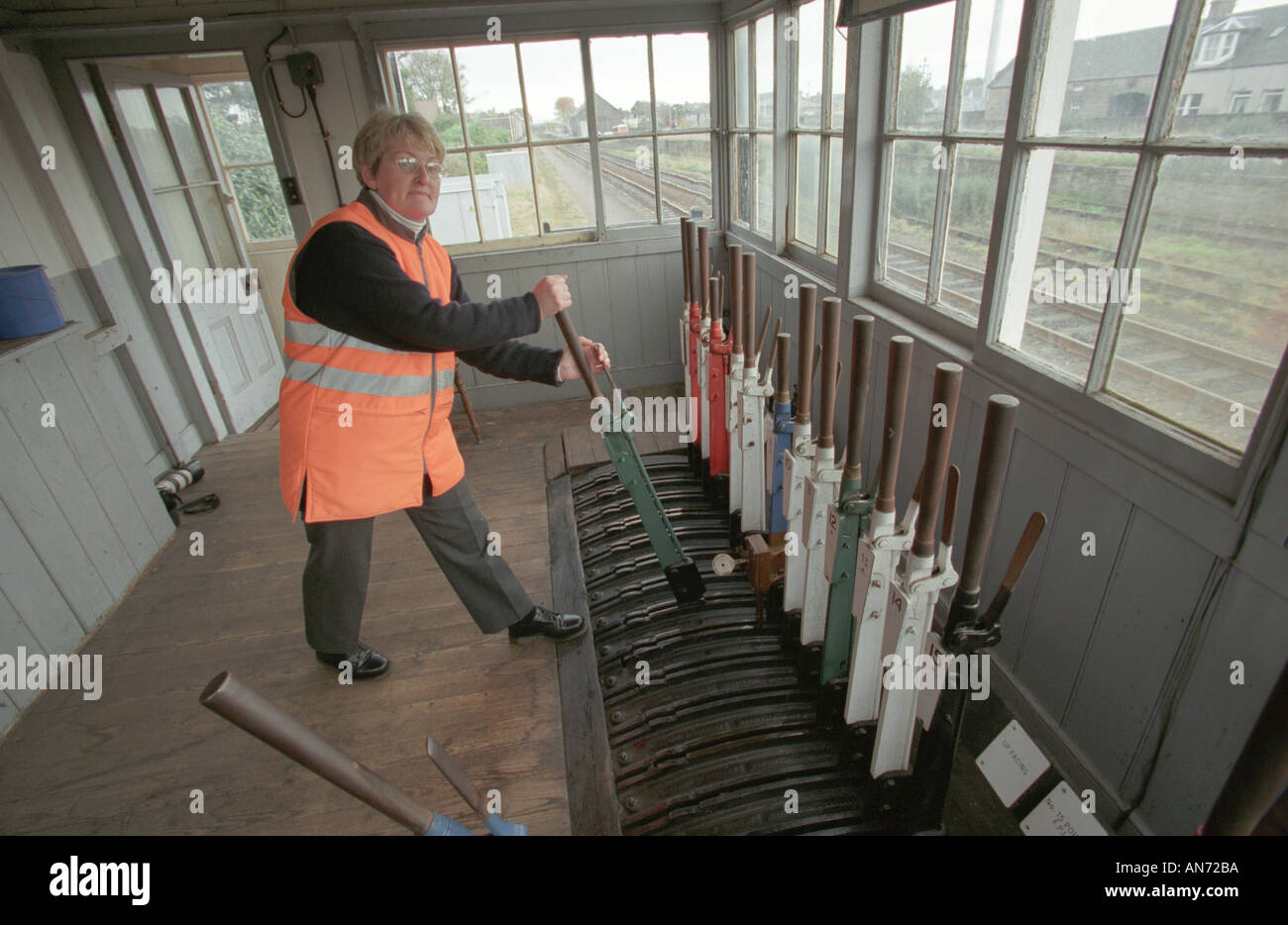 Female signal box operator at work in Nairn station near Inverness ...