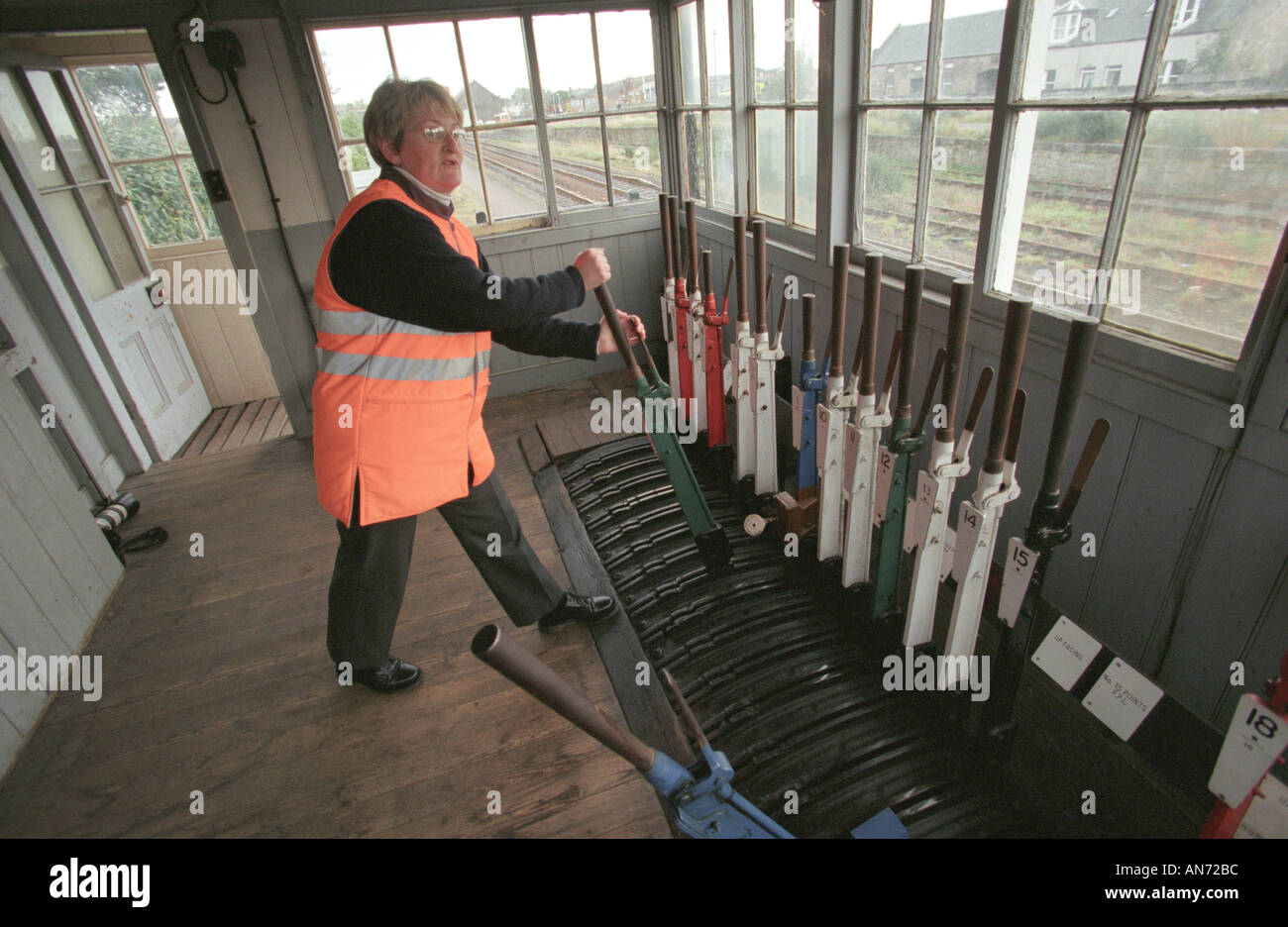 Female signal box operator at work in Nairn station near Inverness ...