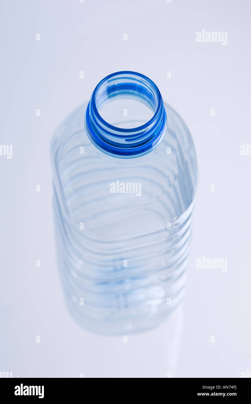 Empty clear blue water bottle Stock Photo - Alamy