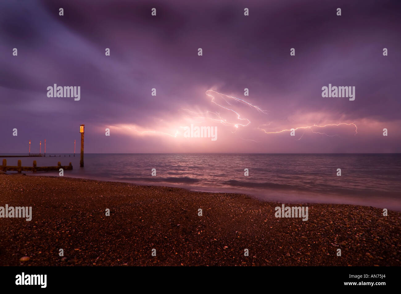 Long exposure of lightning storm over the ocean Stock Photo - Alamy