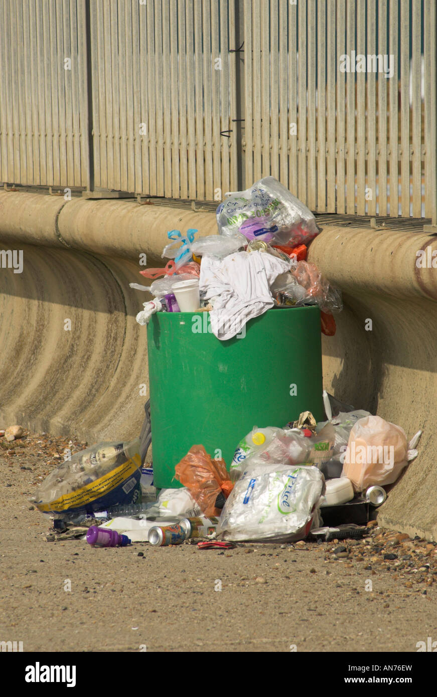 An overflowing waste bin Stock Photo - Alamy