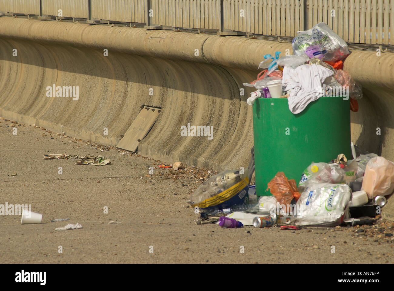 An overflowing waste bin Stock Photo - Alamy