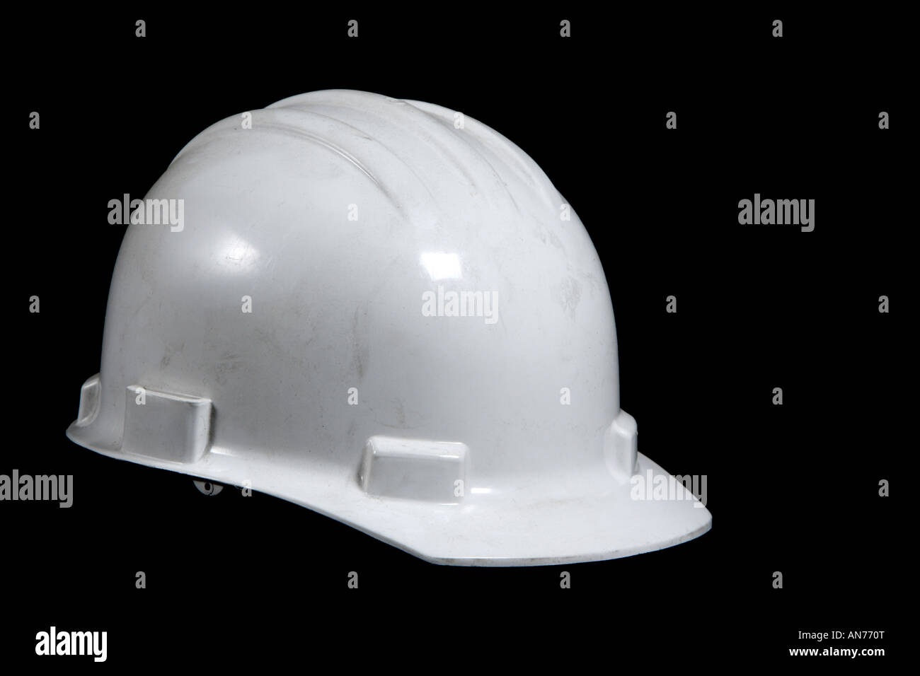 White Hard Hat in the studio on Black Stock Photo - Alamy