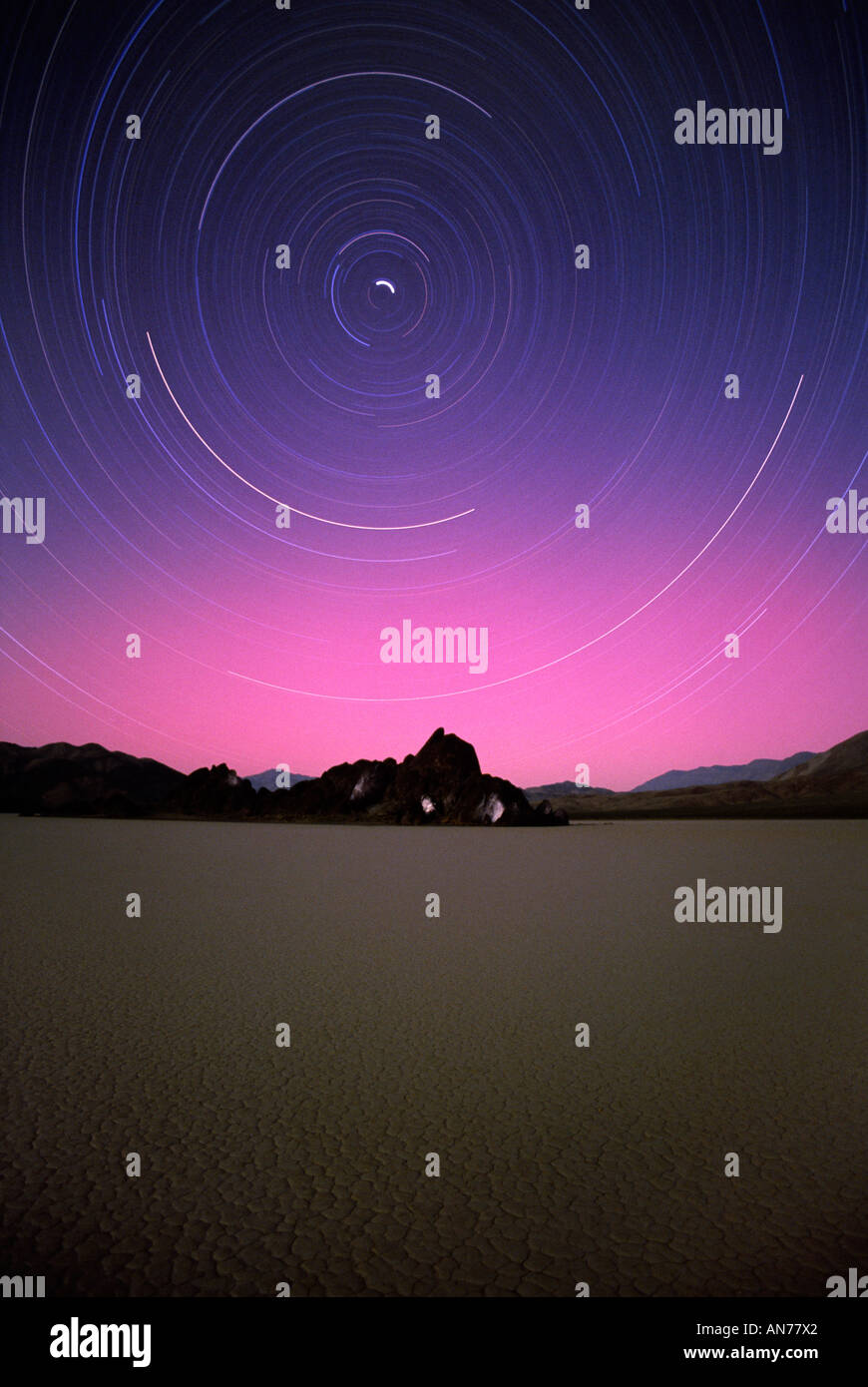 NIGHT SKY turning around NORTH STAR above DEATH VALLEY CALIFORNIA Stock ...