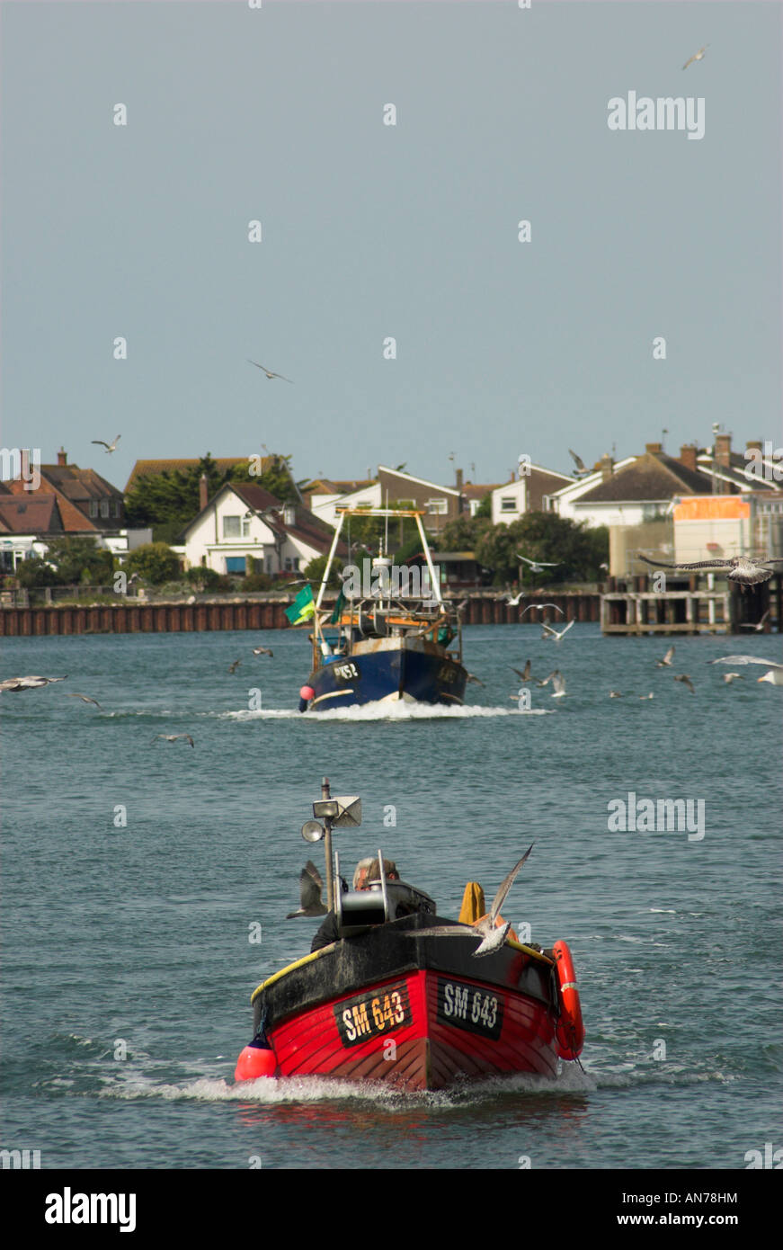 Two fishing boats approach Shoreham Port having just passed through the ...