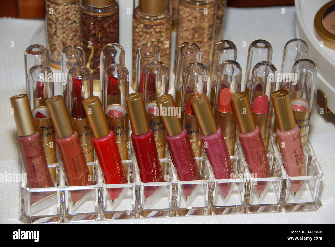 Selection of lipstick and lip gloss in a beauty salon Stock Photo - Alamy