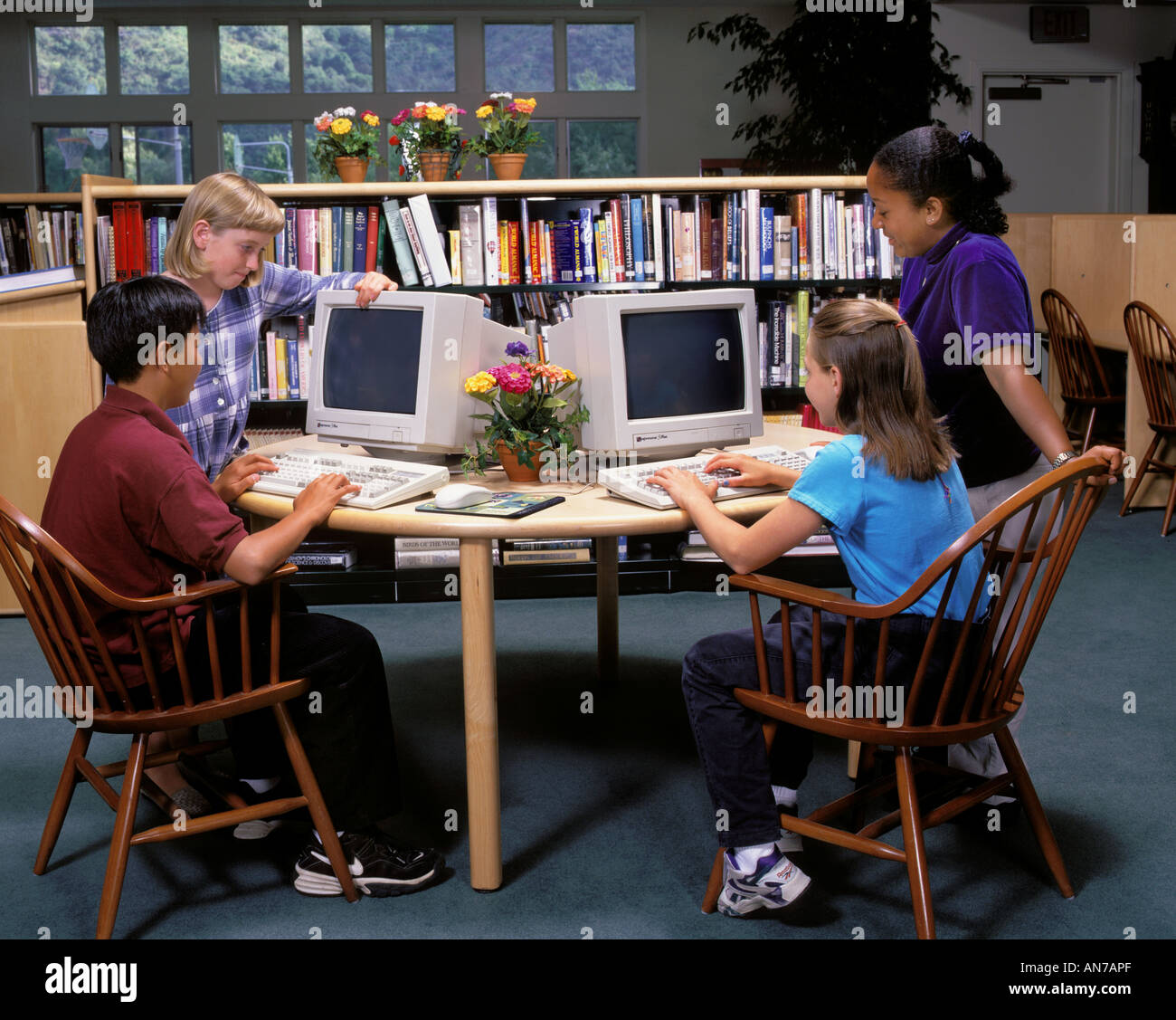 Grade school library students computers hi-res stock photography and ...
