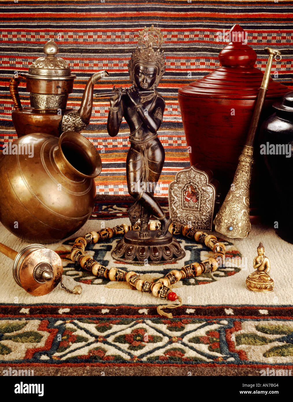 ASIAN ARTIFACTS RITUAL OBJECTS with KRISHNA STATUE Stock Photo - Alamy