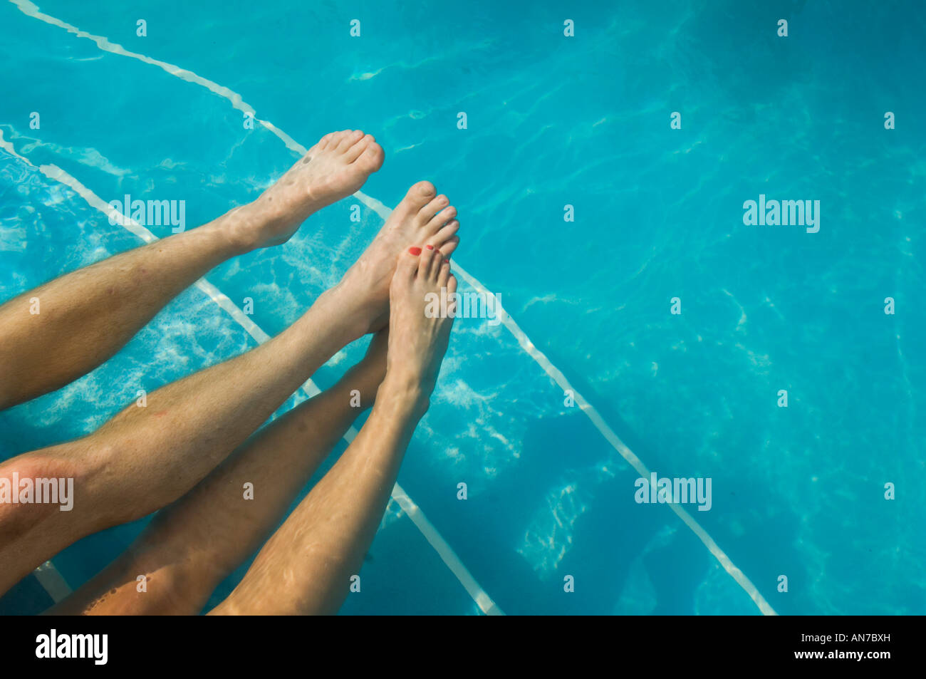 Couple by swimming pool hi-res stock photography and images - Alamy