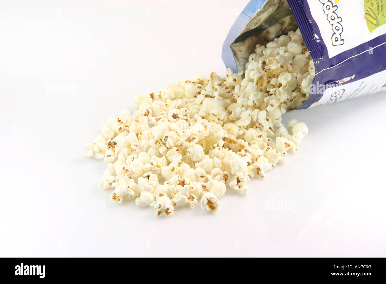 bag full of pop corn on white background food concepts Stock Photo - Alamy
