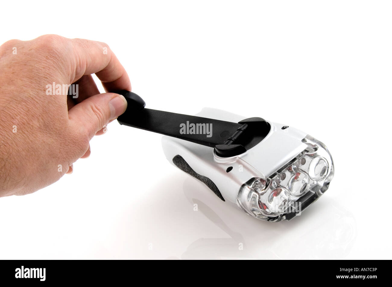 hand winding up a torch Stock Photo - Alamy