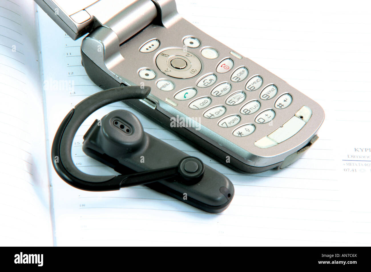 cell phone detail with hands free on diary communication concepts Stock ...