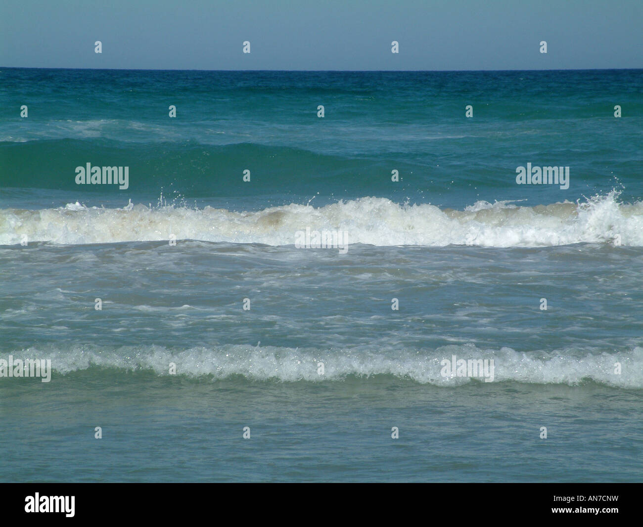 waves breaking on beach, San Juan Playa, Alicante, Spain Stock Photo ...