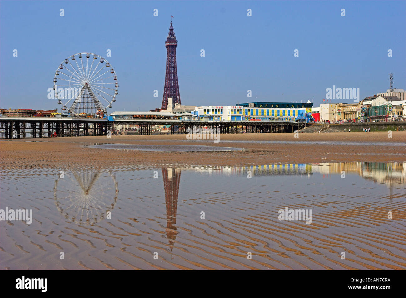 Blackpool tower and central Pier reflected in pools of water on the ...