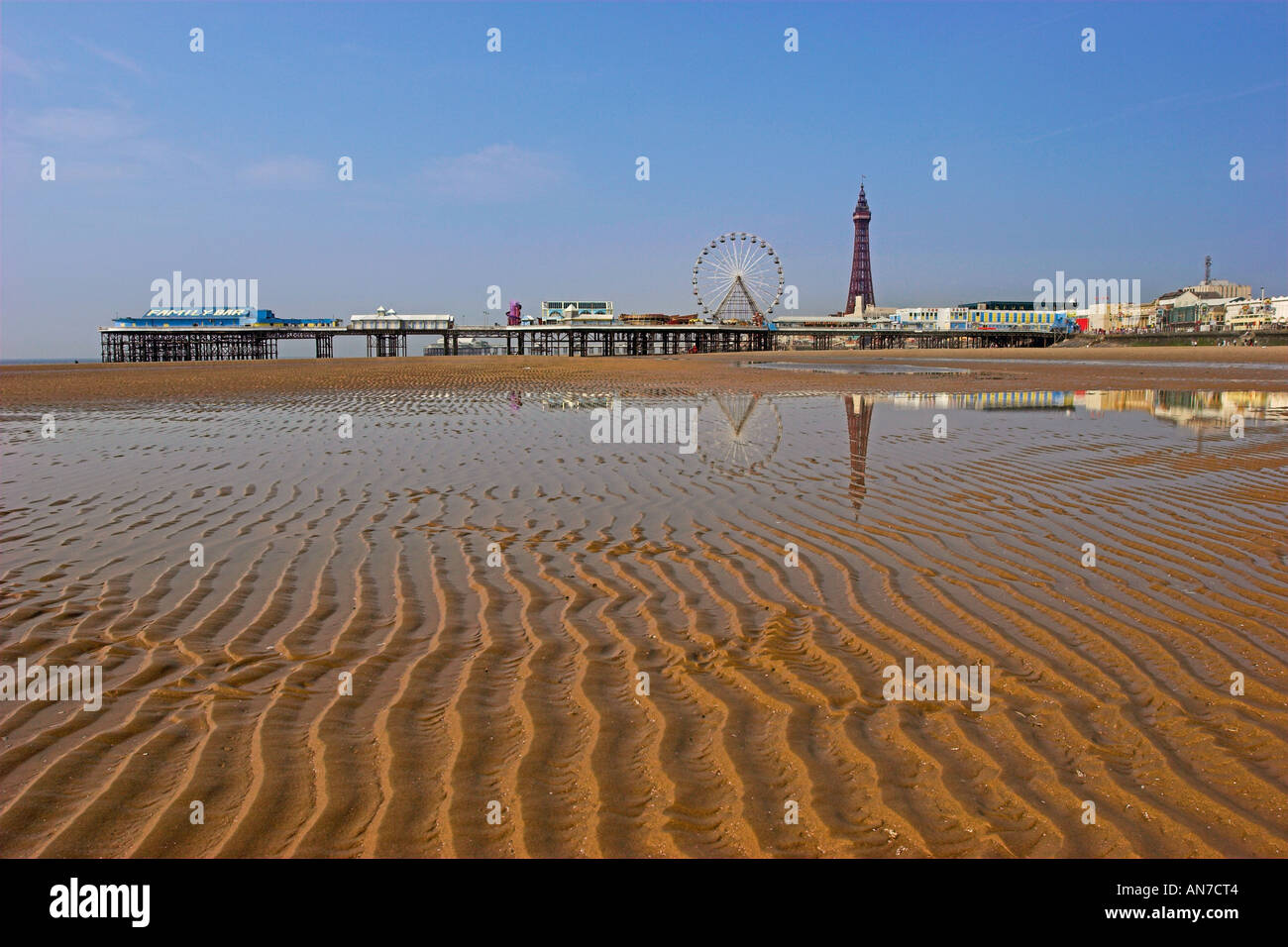 Blackpool tower and central Pier reflected in pools of water on the ...
