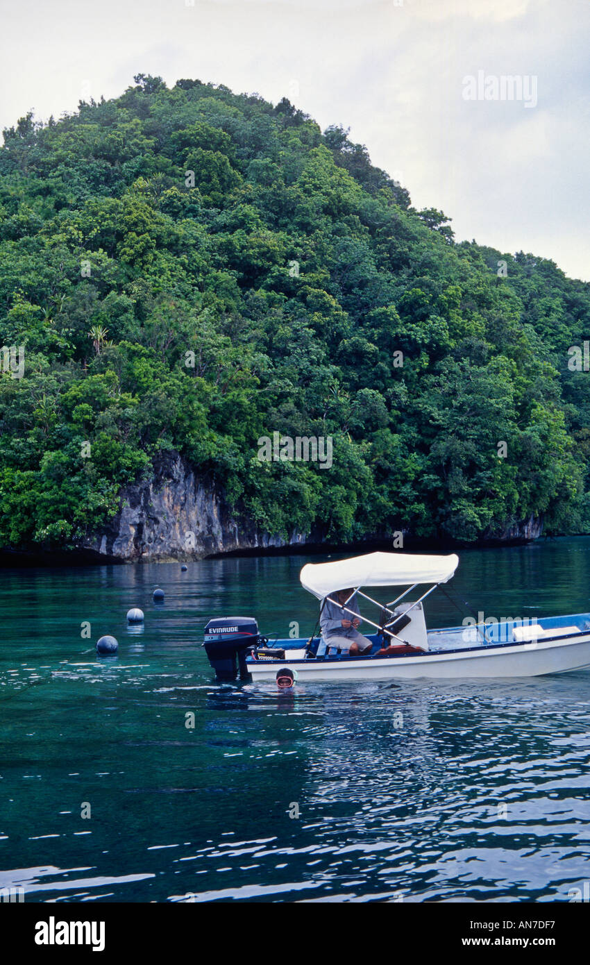 Scuba diver next to fishing boat Palau Micronesia Stock Photo - Alamy