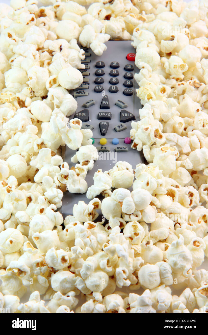 television remote control under pop corn background food and ...